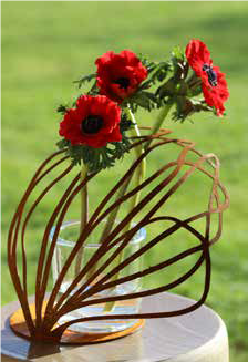 Langwerpig licht gebogen blad op ronde plaat, roest design - Rustique ...
